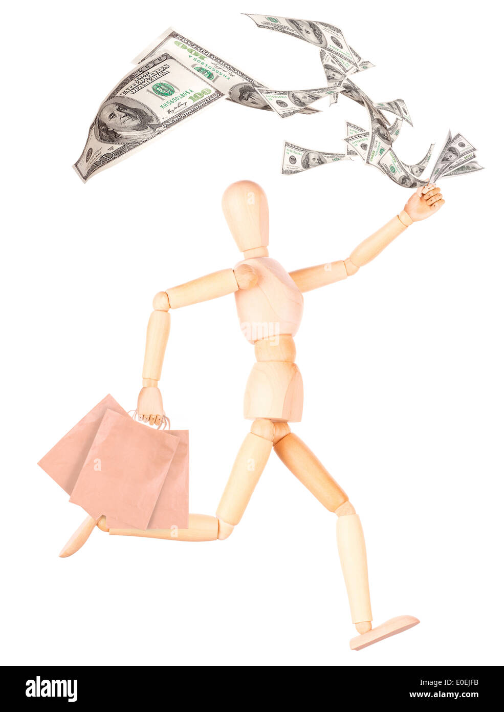 happy wooden Dummy with shopping bags and money isolated Stock Photo ...