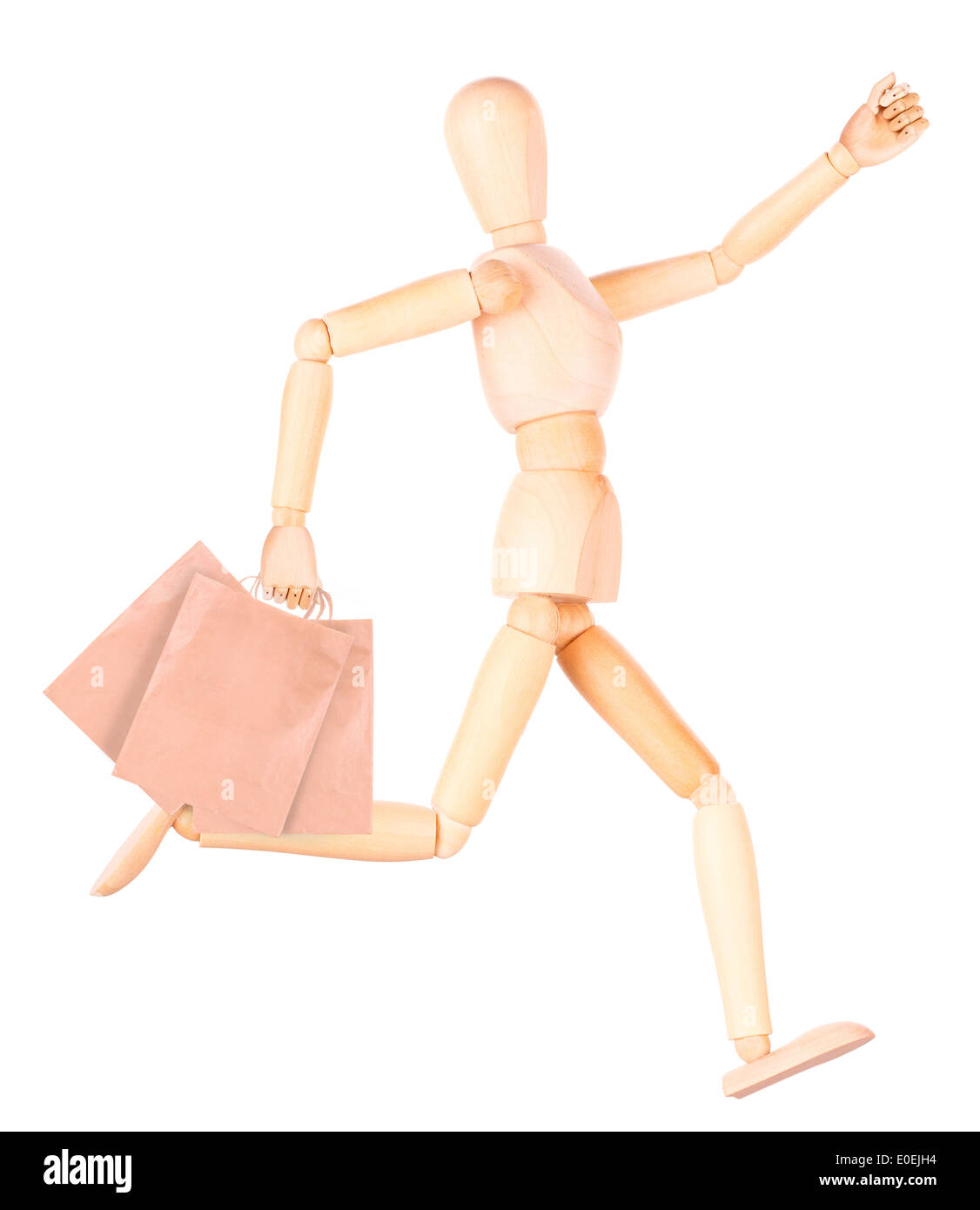 happy wooden Dummy with shopping bags isolated Stock Photo - Alamy
