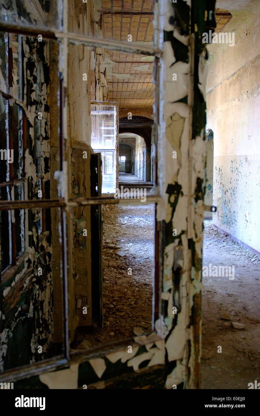 Room with open windows in a run-down building Stock Photo - Alamy