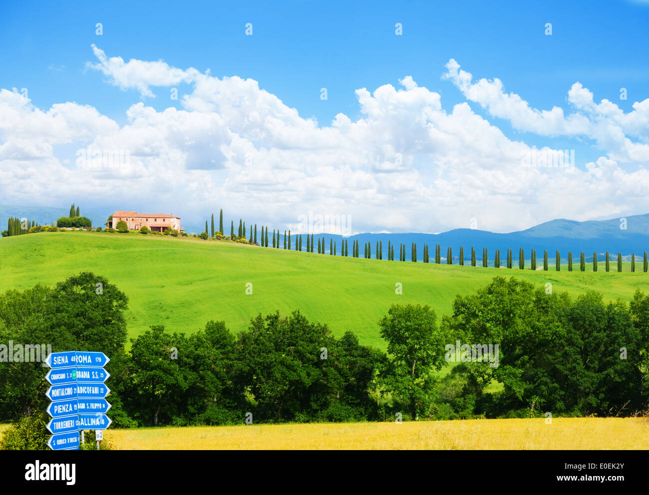 Tuscany landscape with blue sign, house in Italy Stock Photo - Alamy
