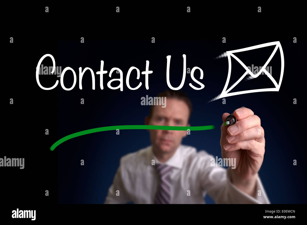 A businessman writing contact us on a screen Stock Photo - Alamy