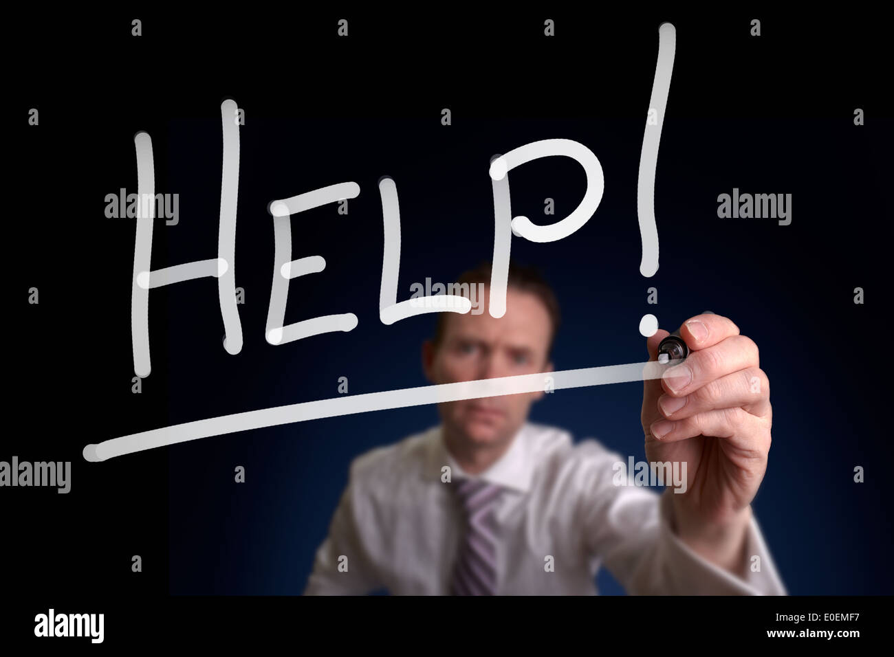 Businessman writing the word help hi-res stock photography and images ...