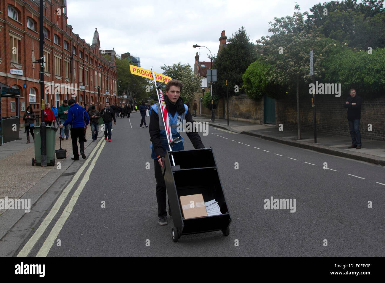 A vendor selling match day programmes hi-res stock photography and ...
