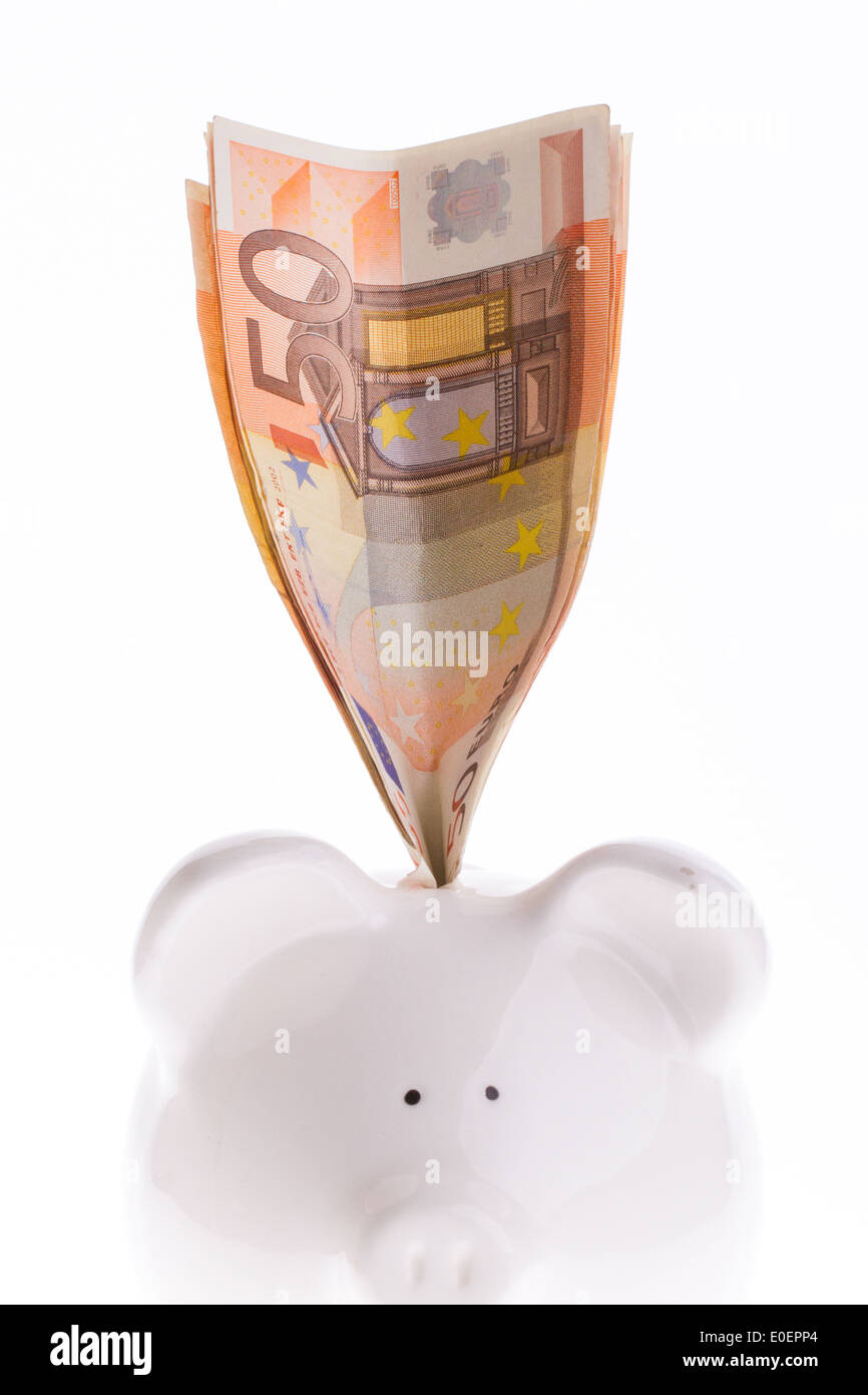 Saving fifty euro in a white money box Stock Photo - Alamy