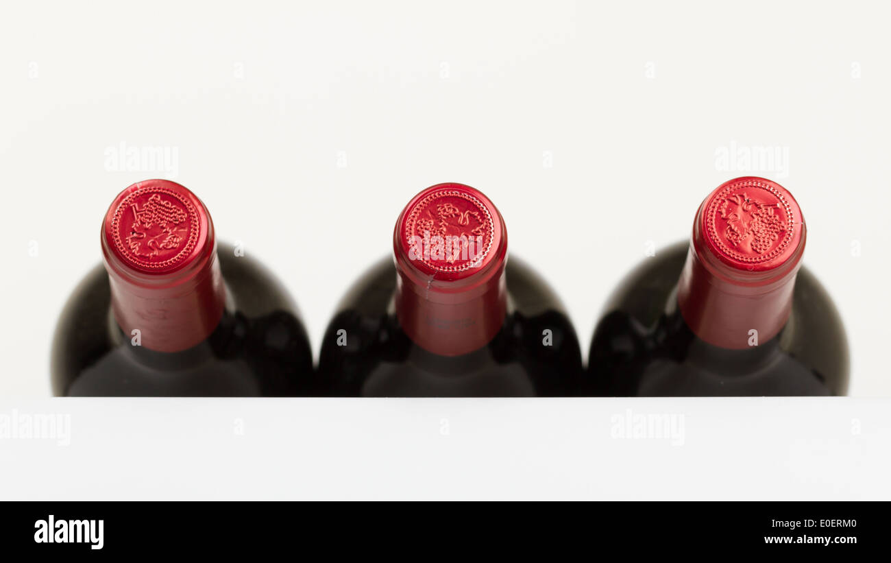 Three bottles of wine isolated on white background Stock Photo - Alamy