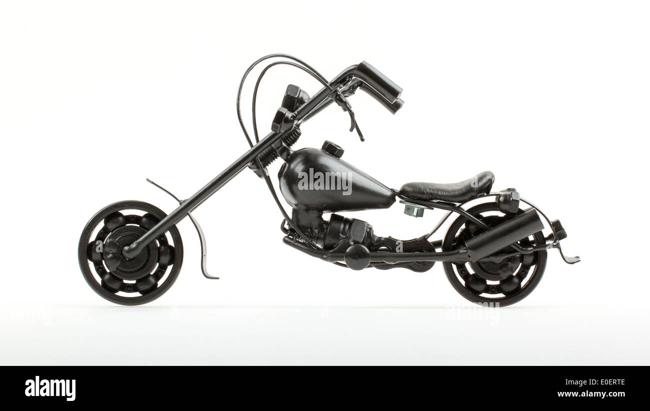 Mini motorcycle made from wire and different motorcycle parts, on white ...