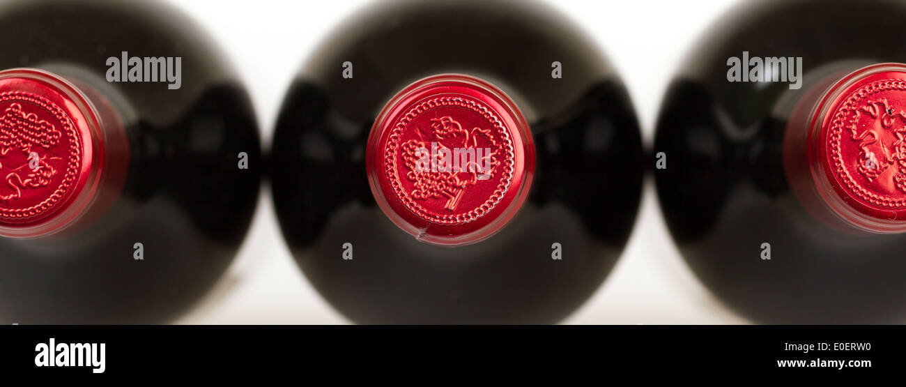 Three bottles of wine isolated on white background Stock Photo - Alamy