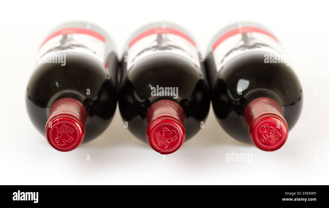 Three bottles of wine isolated on white background Stock Photo - Alamy