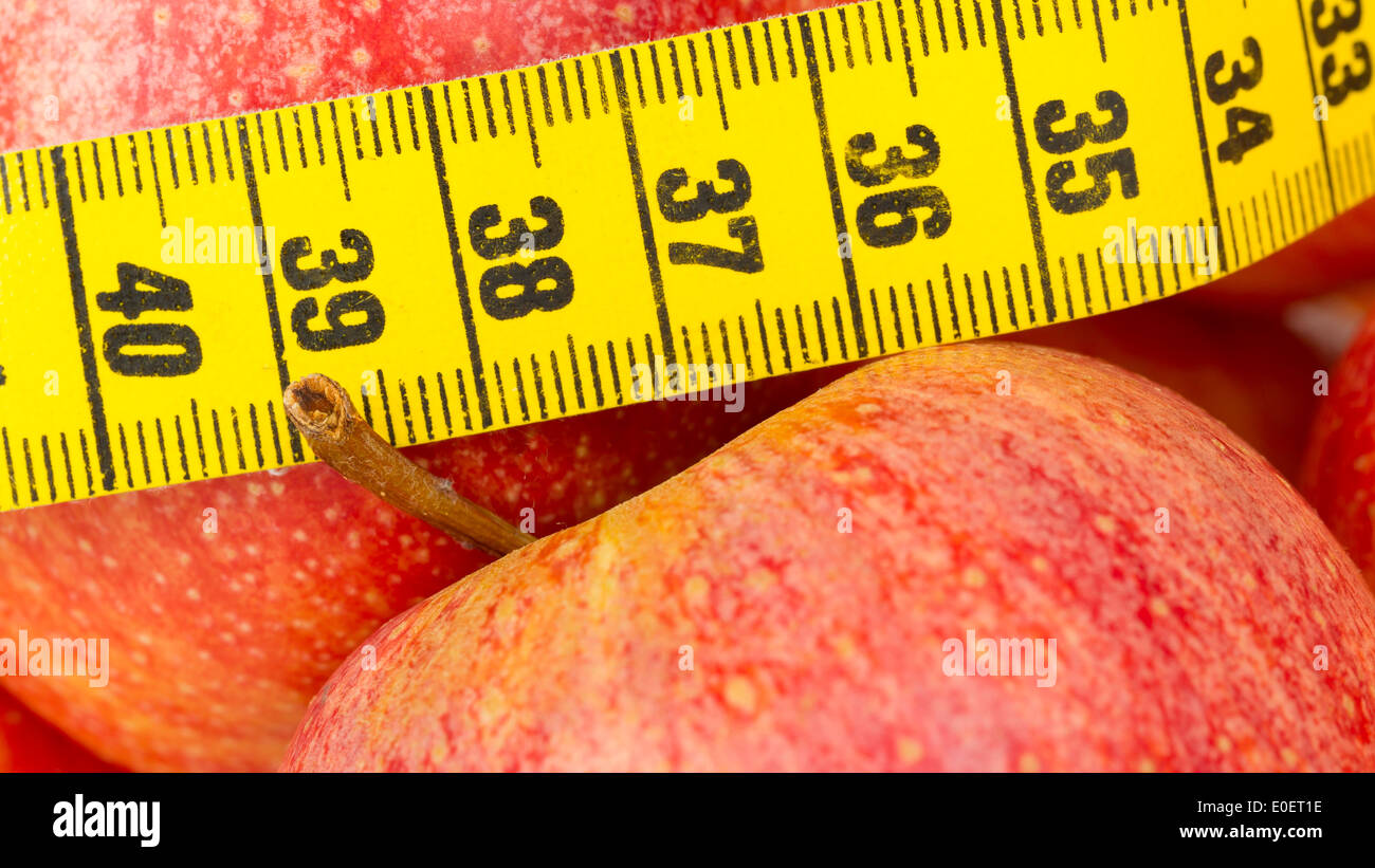 Red apples with a yellow tape measure hi-res stock photography and ...