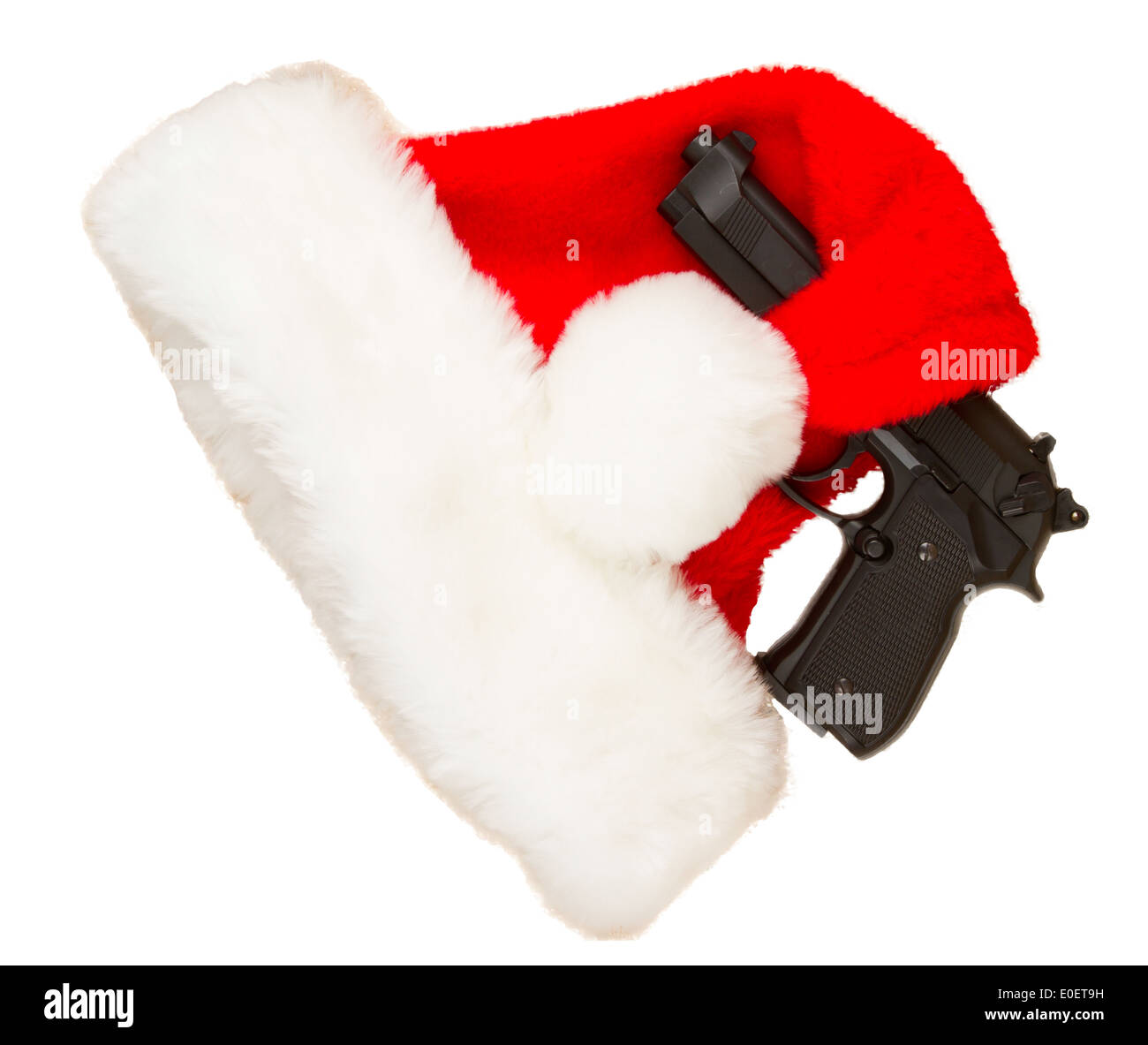 Weapon (firearm) concealed in santas hat, isolated on white Stock Photo ...