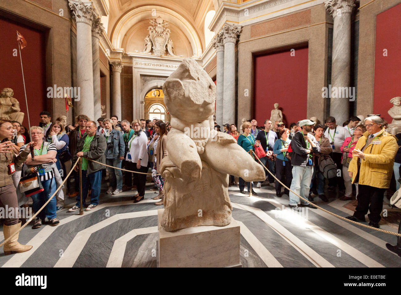 Tourists in the Vatican Museums looking at the Belvedere Torso ...