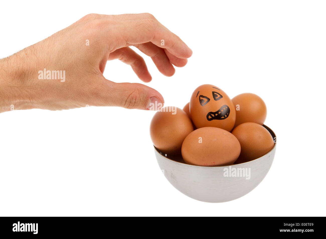Scared egg, waiting to be grabbed by a hand, isolated Stock Photo - Alamy