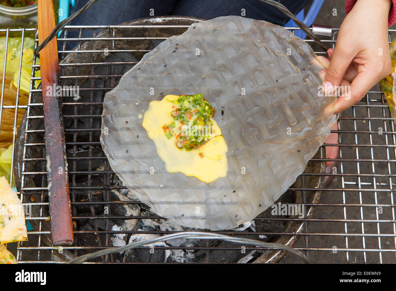 Rice paper meal being made on a barbeque, Vietnam Stock Photo - Alamy