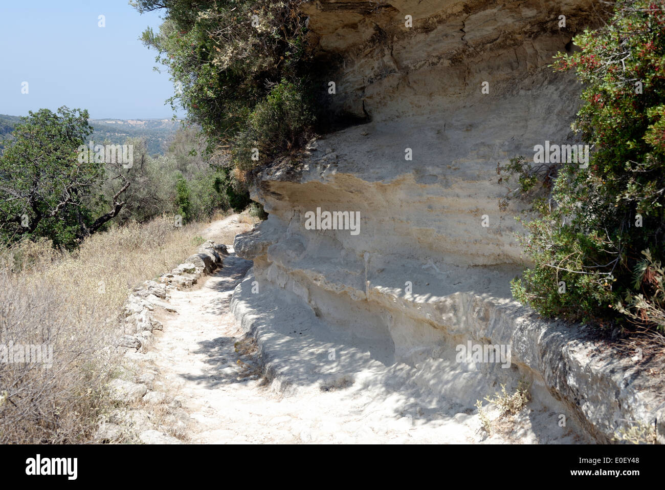 Pathway leading past groves on ancient cistern walls on Acropolis ridge ...
