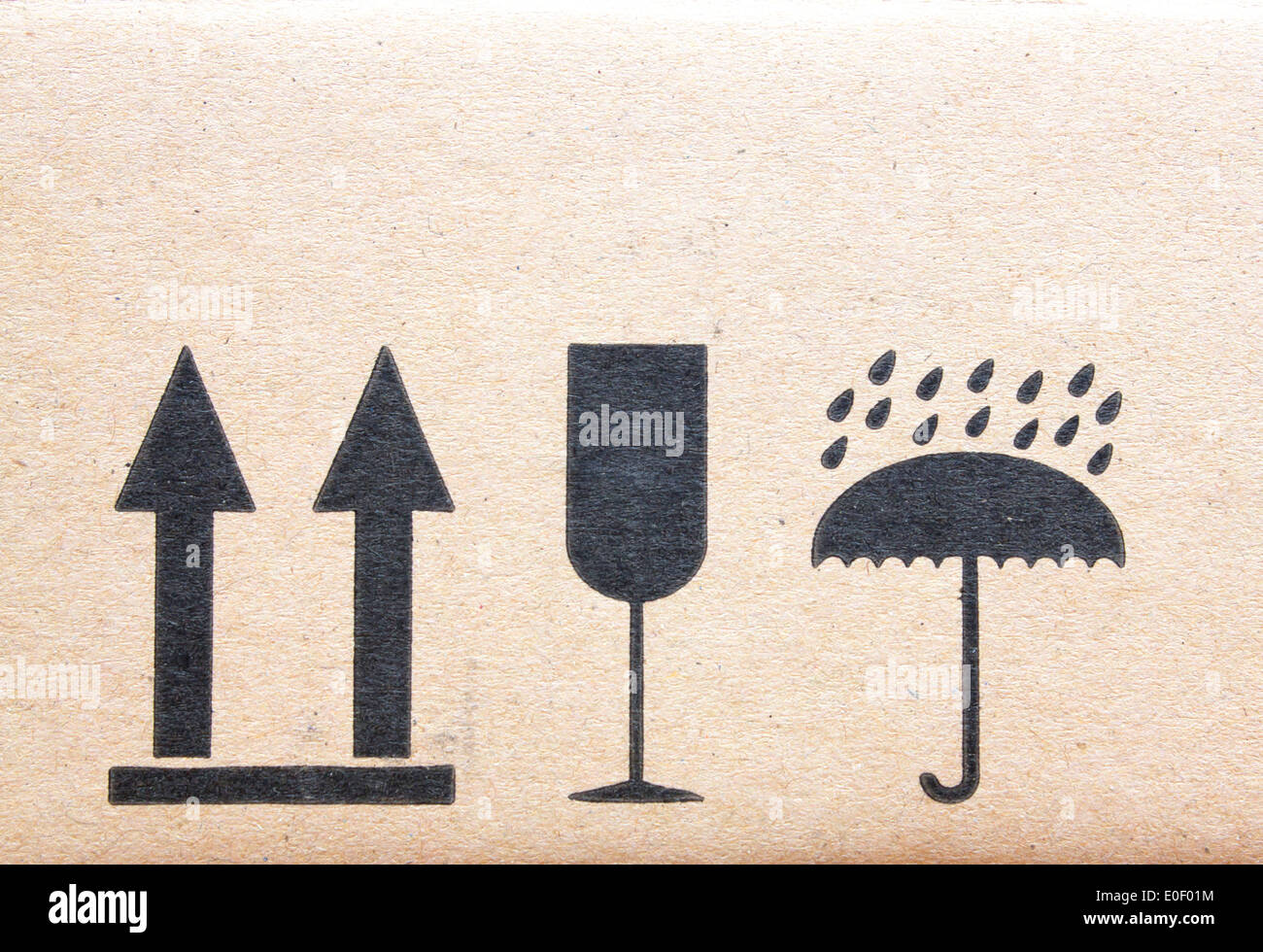 Black fragile symbol on cardboard, brown paper box Stock Photo - Alamy