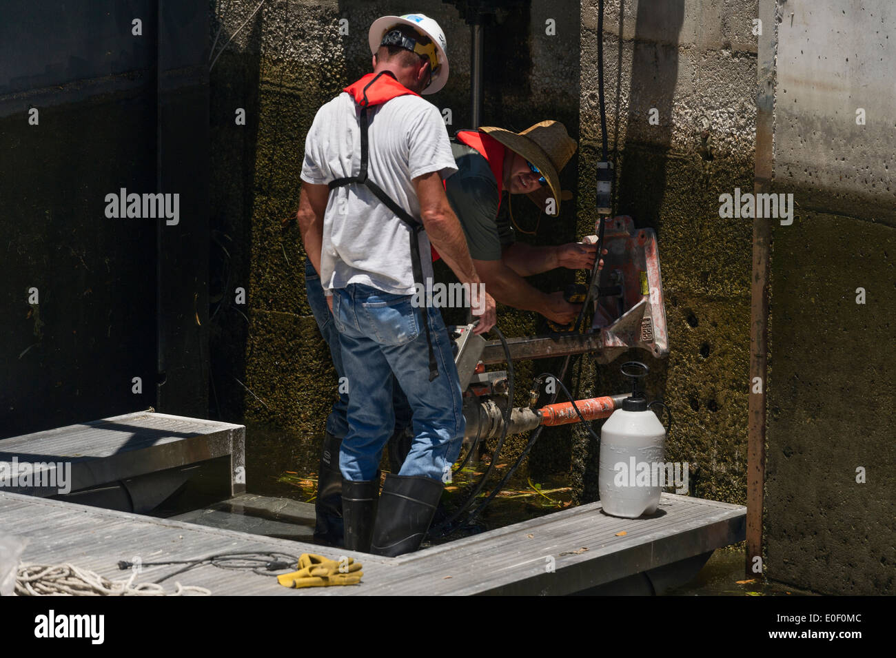 Two men coring concrete at the Burrell Navigational lock and Dam in ...