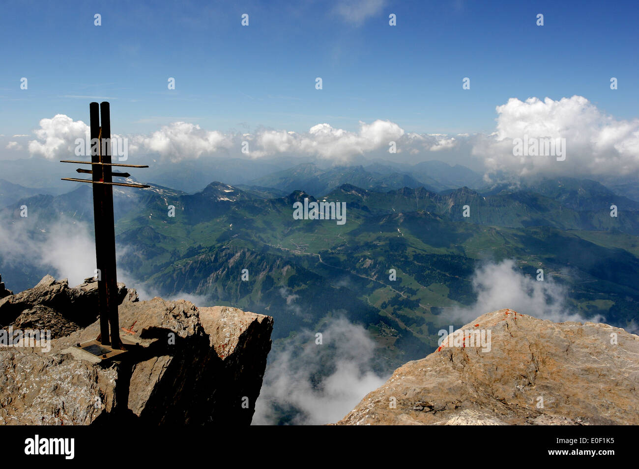 The summit of the Haute Cime, Dents du Midi with iron cross Stock Photo ...