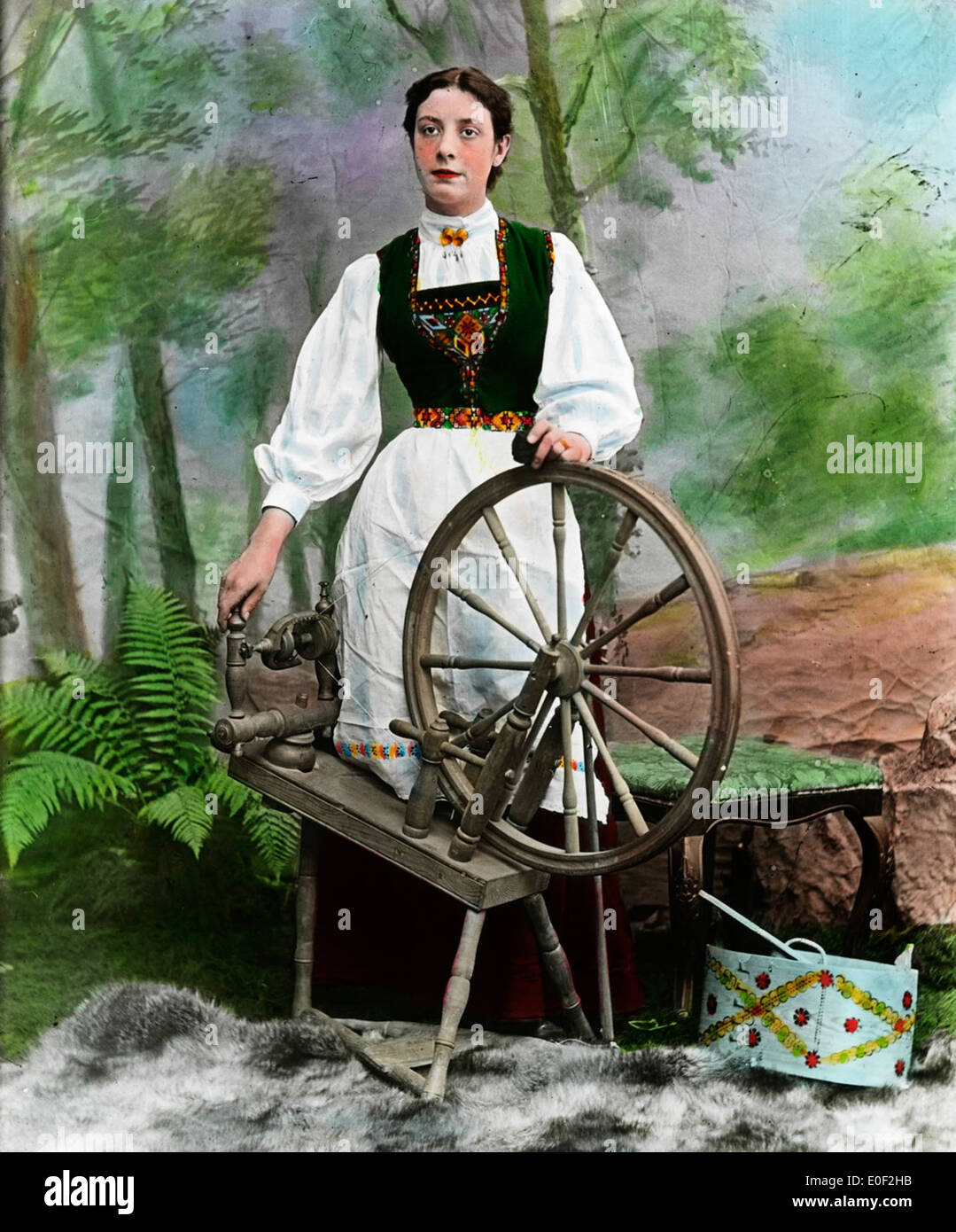 Woman and spinning wheel Stock Photo - Alamy