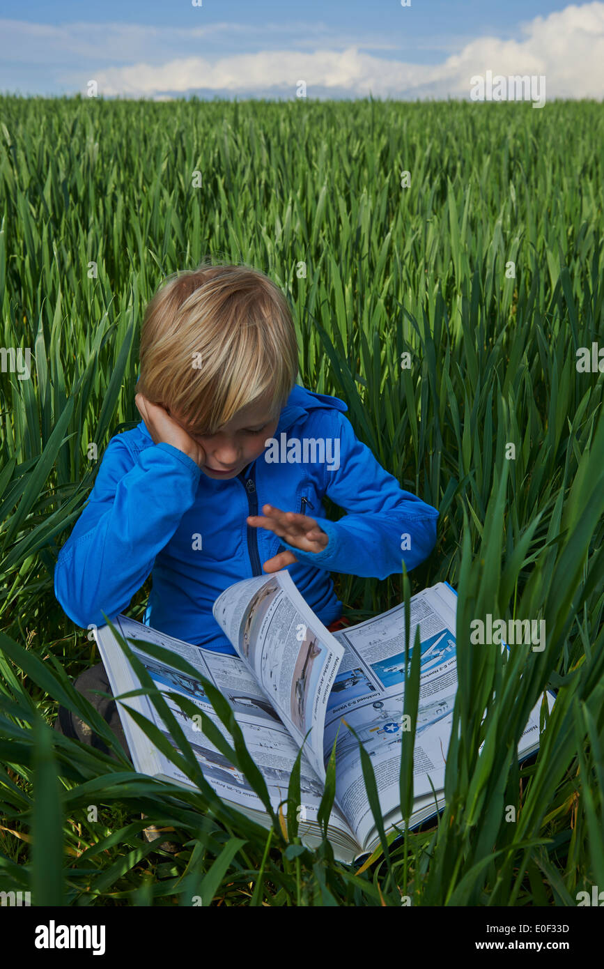Boy reading bible outside hi-res stock photography and images - Alamy
