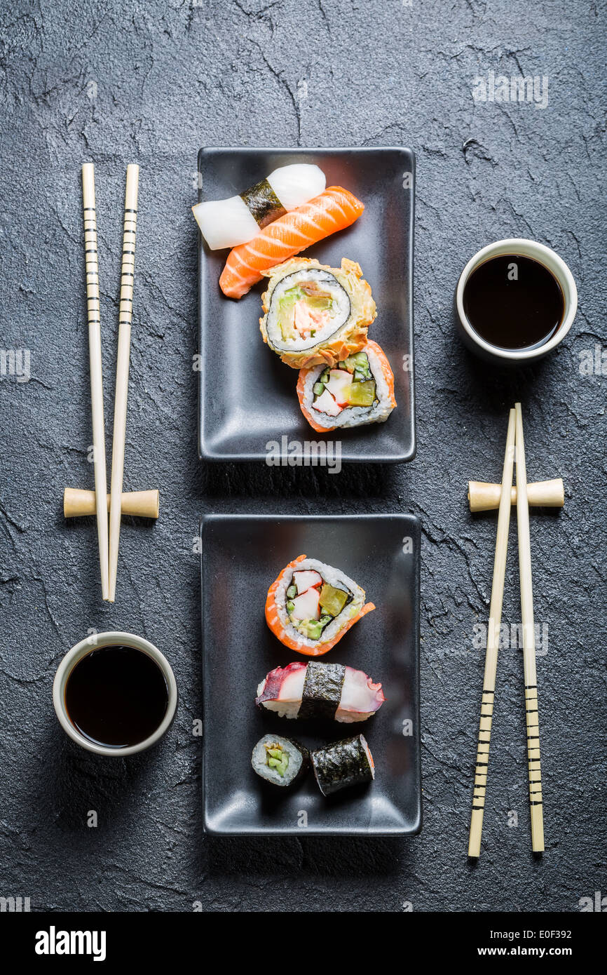 Sushi served on black hi-res stock photography and images - Alamy