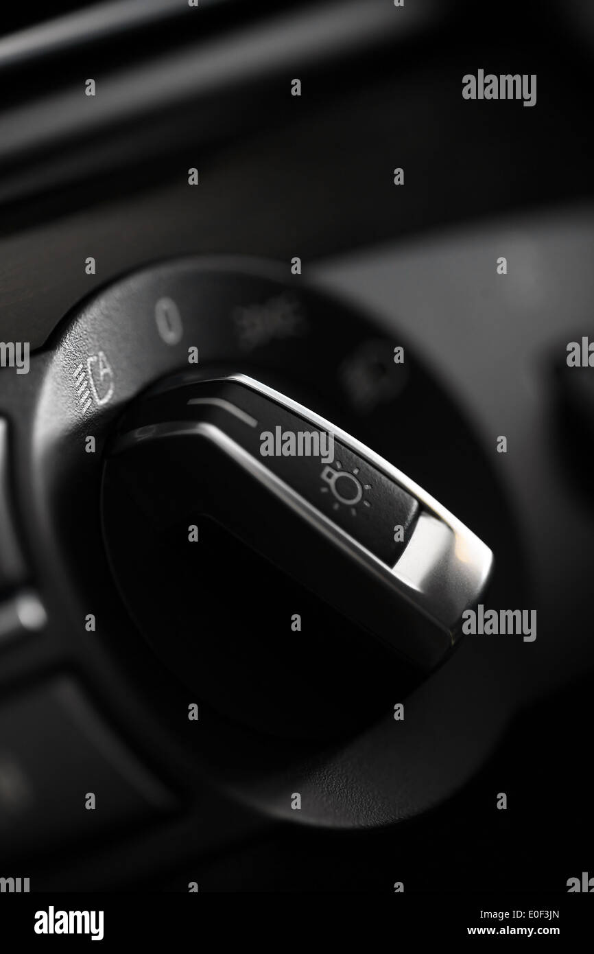 Detail of the headlight button in a car Stock Photo - Alamy