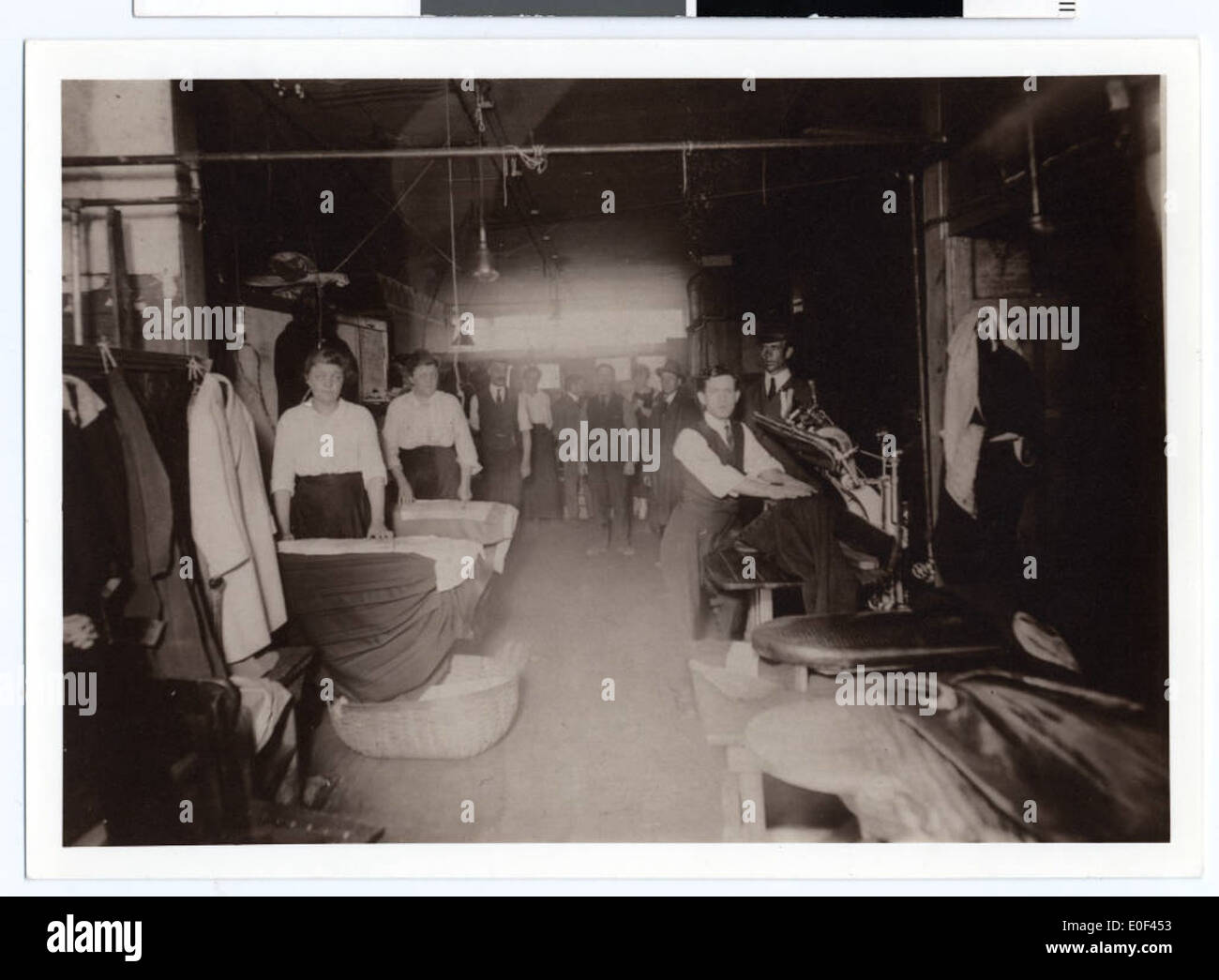 Workers at a laundry shop Stock Photo - Alamy