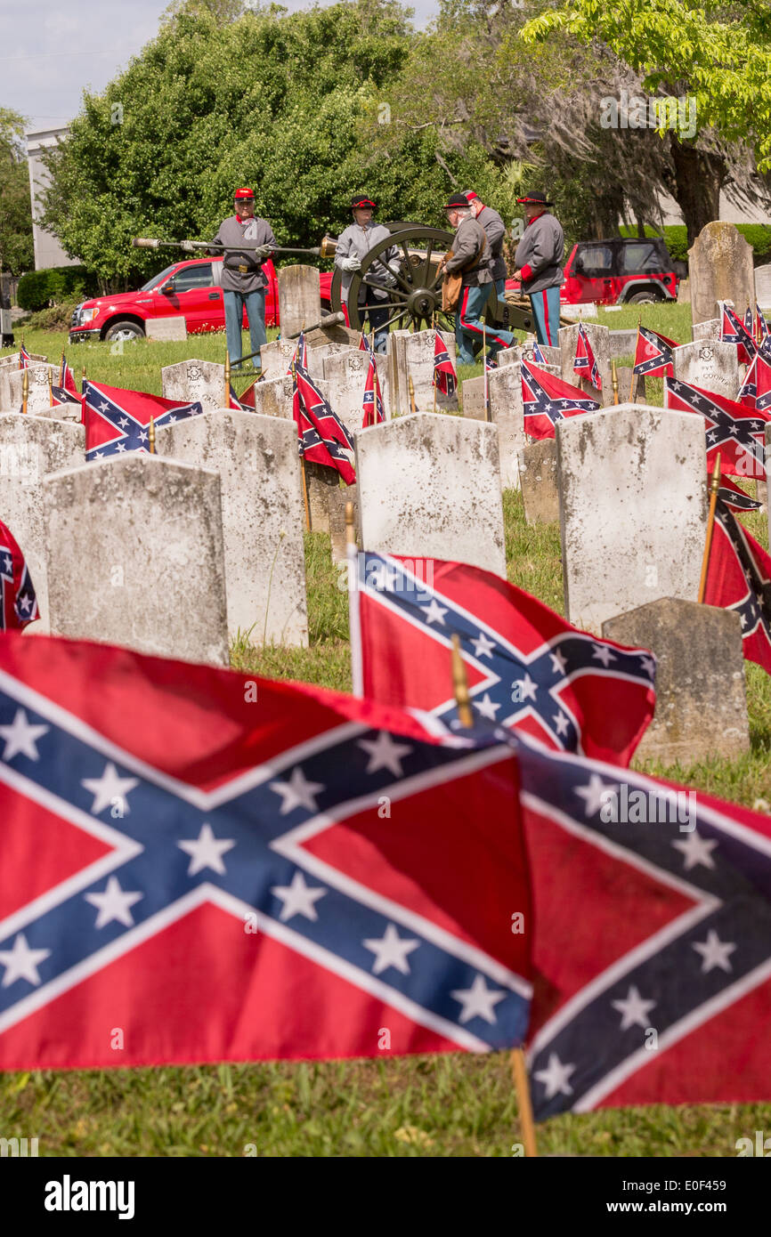 Civil War re-enactors prepare a cannon to fire a gun salute during ...