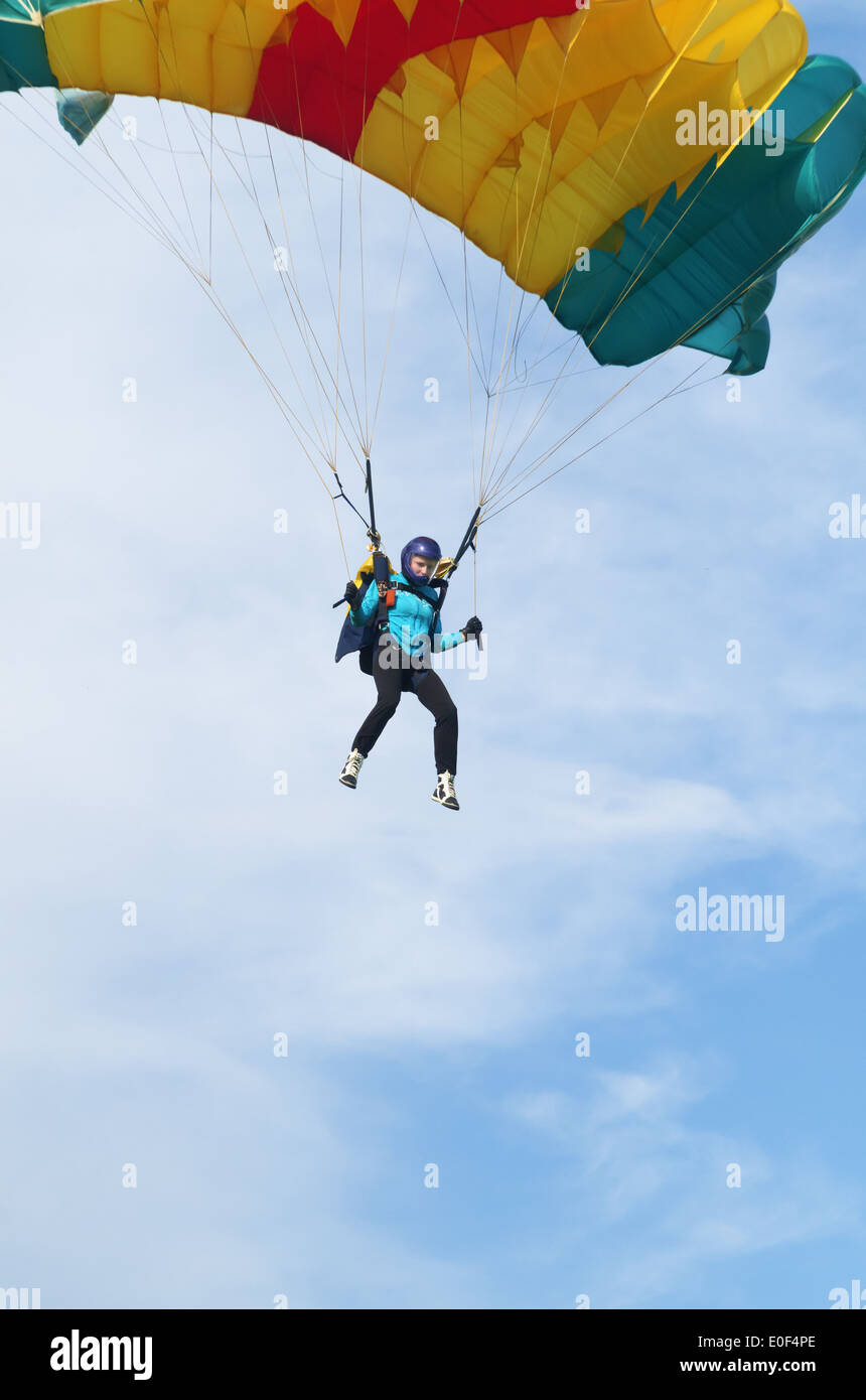One day with parachutist in airfield. The girl skydiver landing under ...