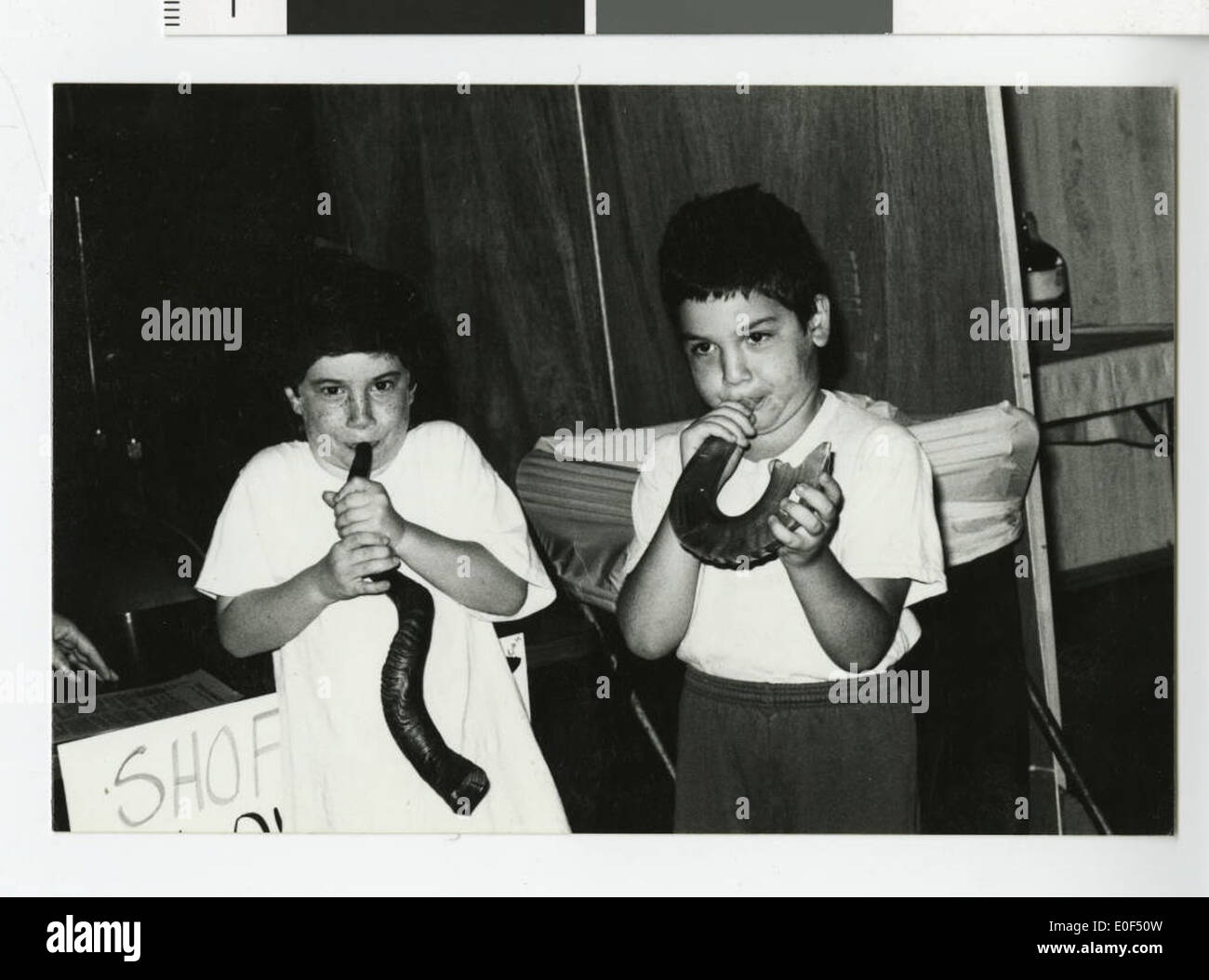 A photograph of children blowing shofars during Rosh Hashanah ...
