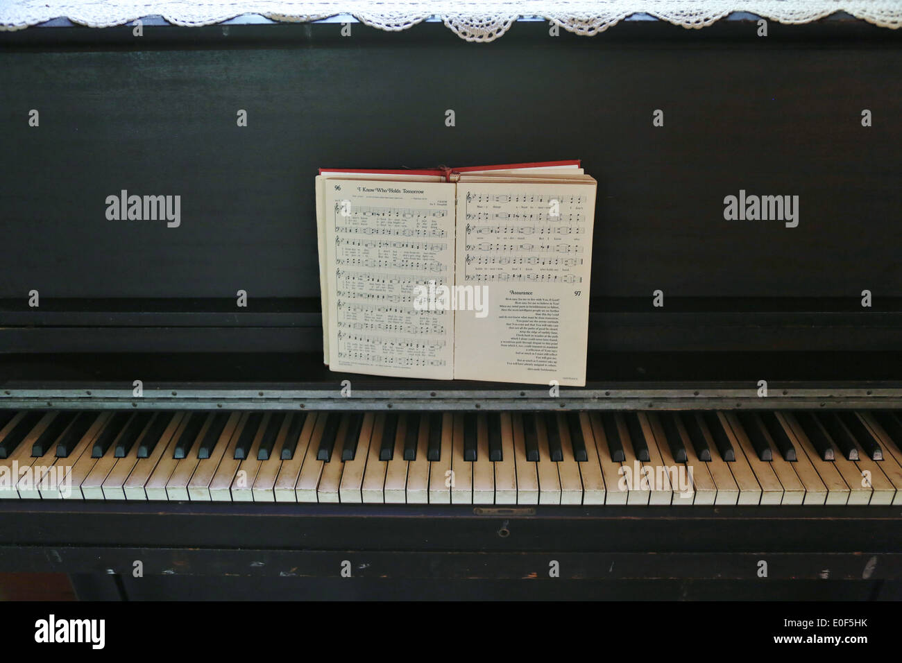 An old piano with an open hymn book Stock Photo - Alamy