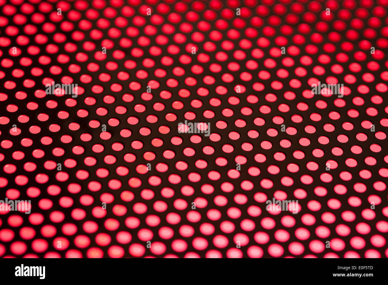 Metal grid with hole patterns and colored lights Stock Photo - Alamy