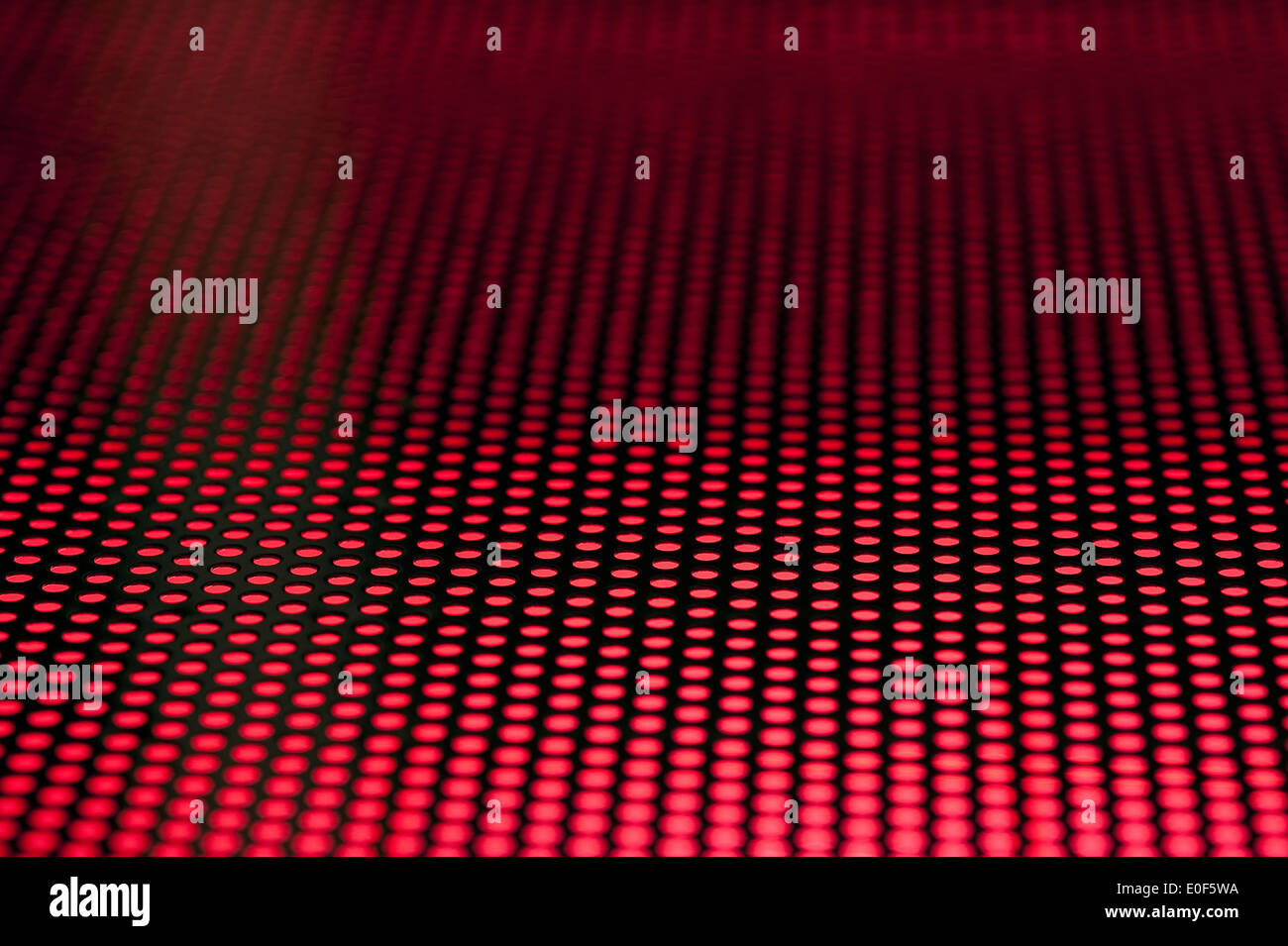 Metal grid with hole patterns and colored lights Stock Photo - Alamy