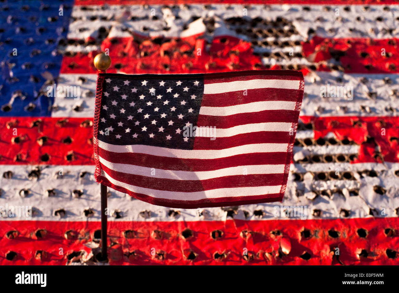 Fourth of July with American flag damaged by fireworks Stock Photo - Alamy