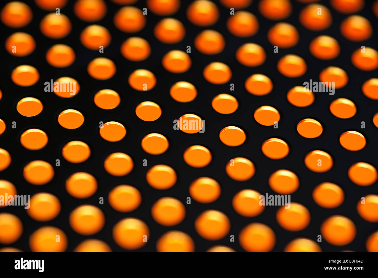 Metal grid with hole patterns and colored lights Stock Photo - Alamy