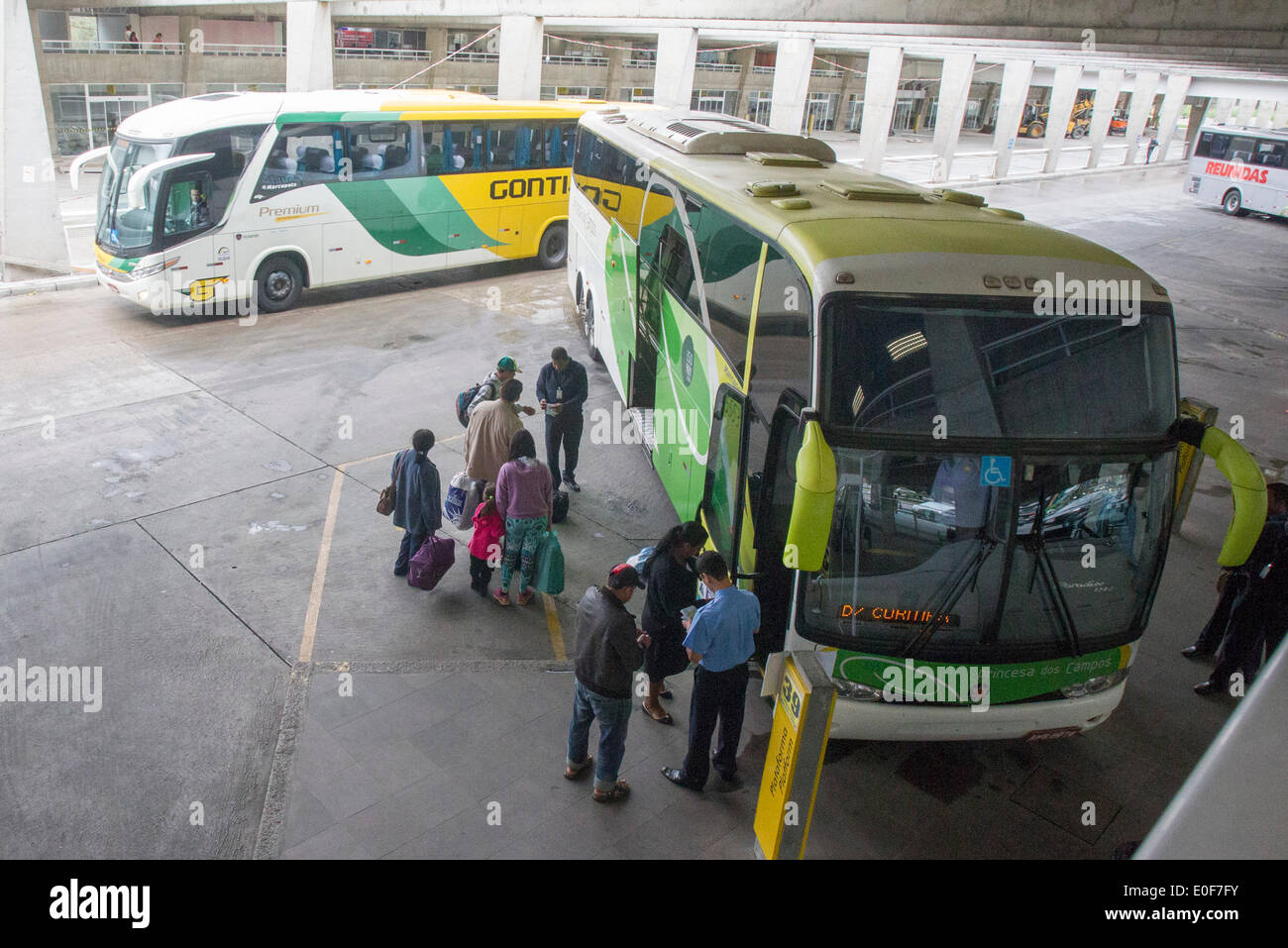 Curitiba, Brazil. 11th May, 2014. People wait to board a bus at ...