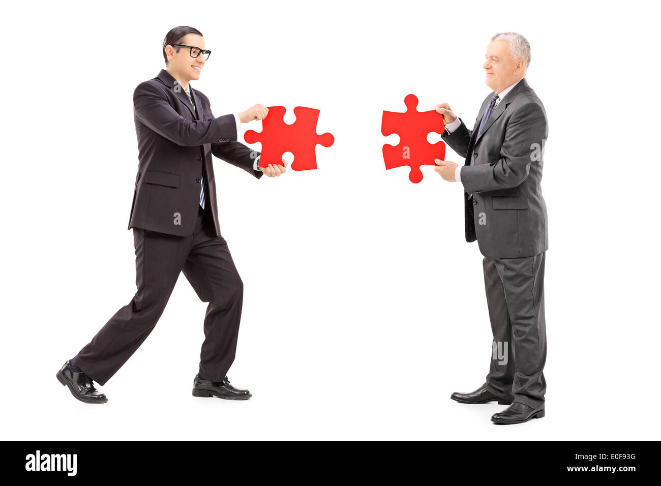 Business people connecting puzzle pieces hi-res stock photography and ...