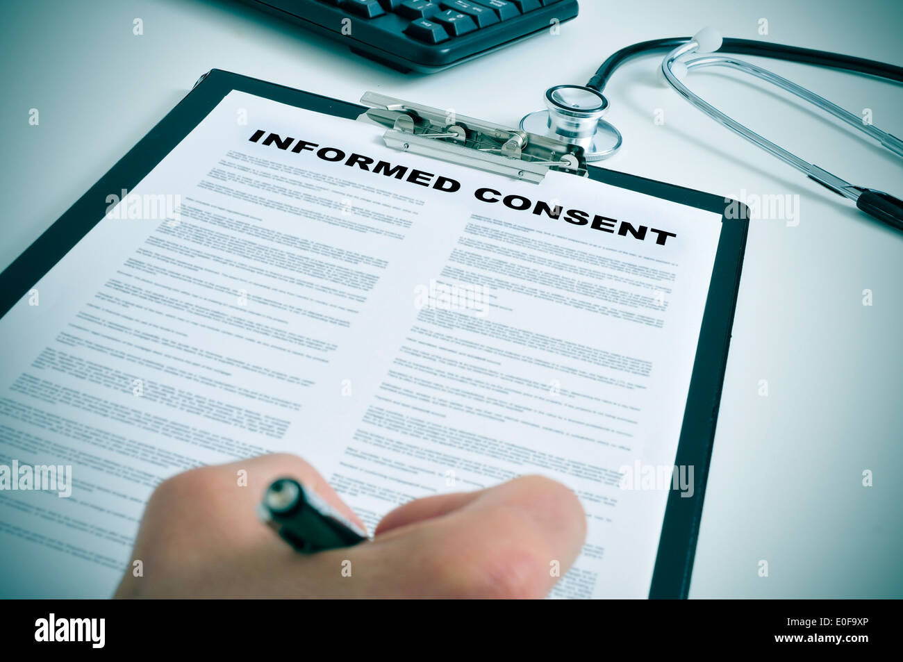 patient signing an informed consent in a doctors office Stock Photo - Alamy