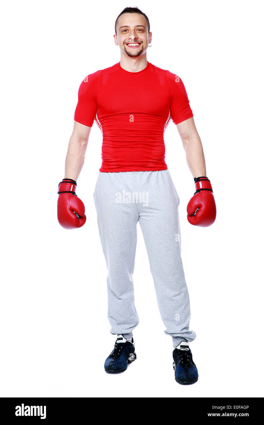 Full length portrait of a happy boxer standing over white background ...