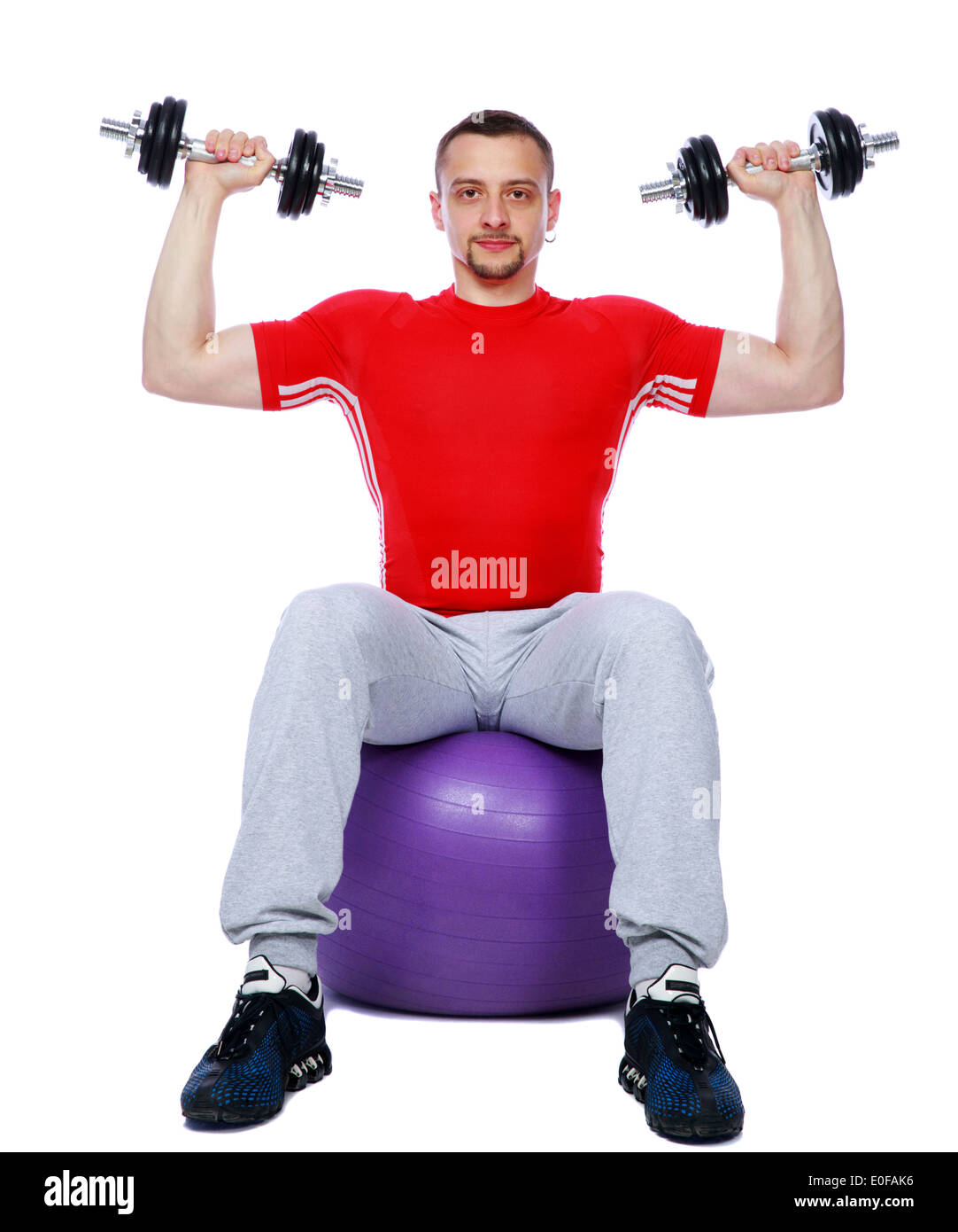 Guy sitting on gym ball hi-res stock photography and images - Alamy