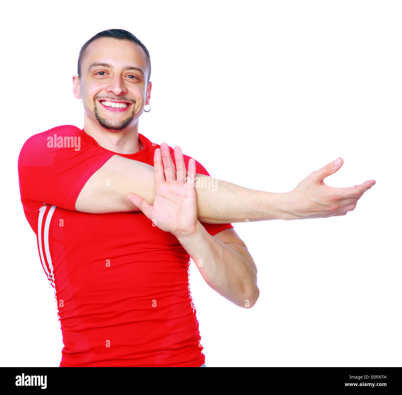 Athletic man stretching the arms, isolated over a white background ...