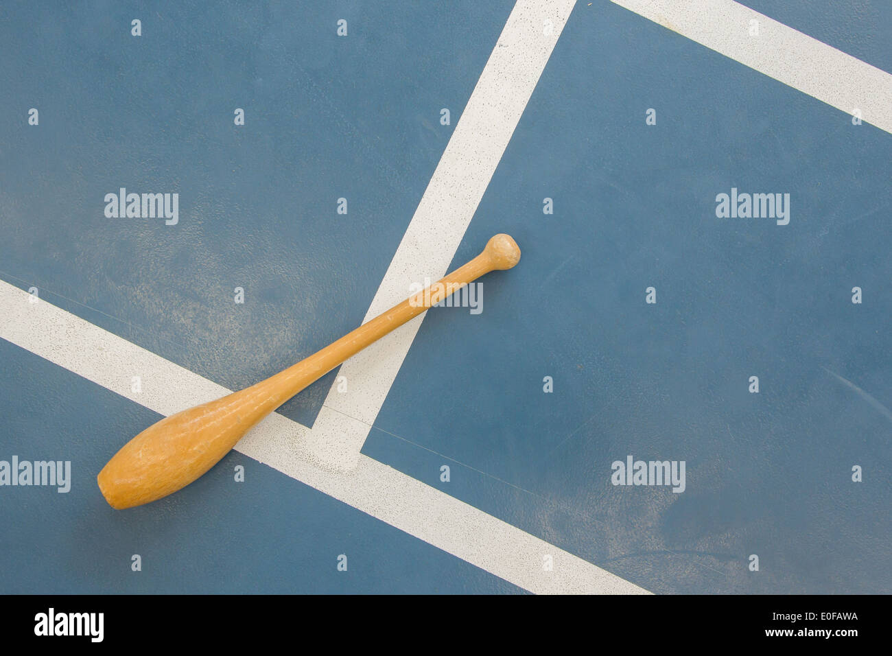 Wooden pin on a blue basketball court Stock Photo - Alamy