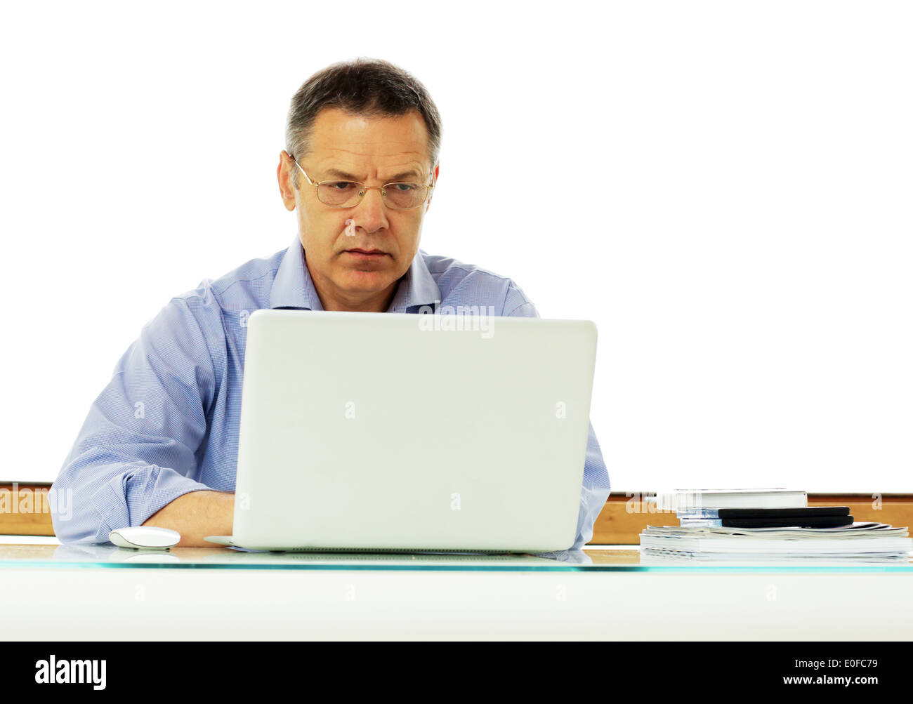 Portrait of a middle aged caucasian man looking at his laptop computer ...