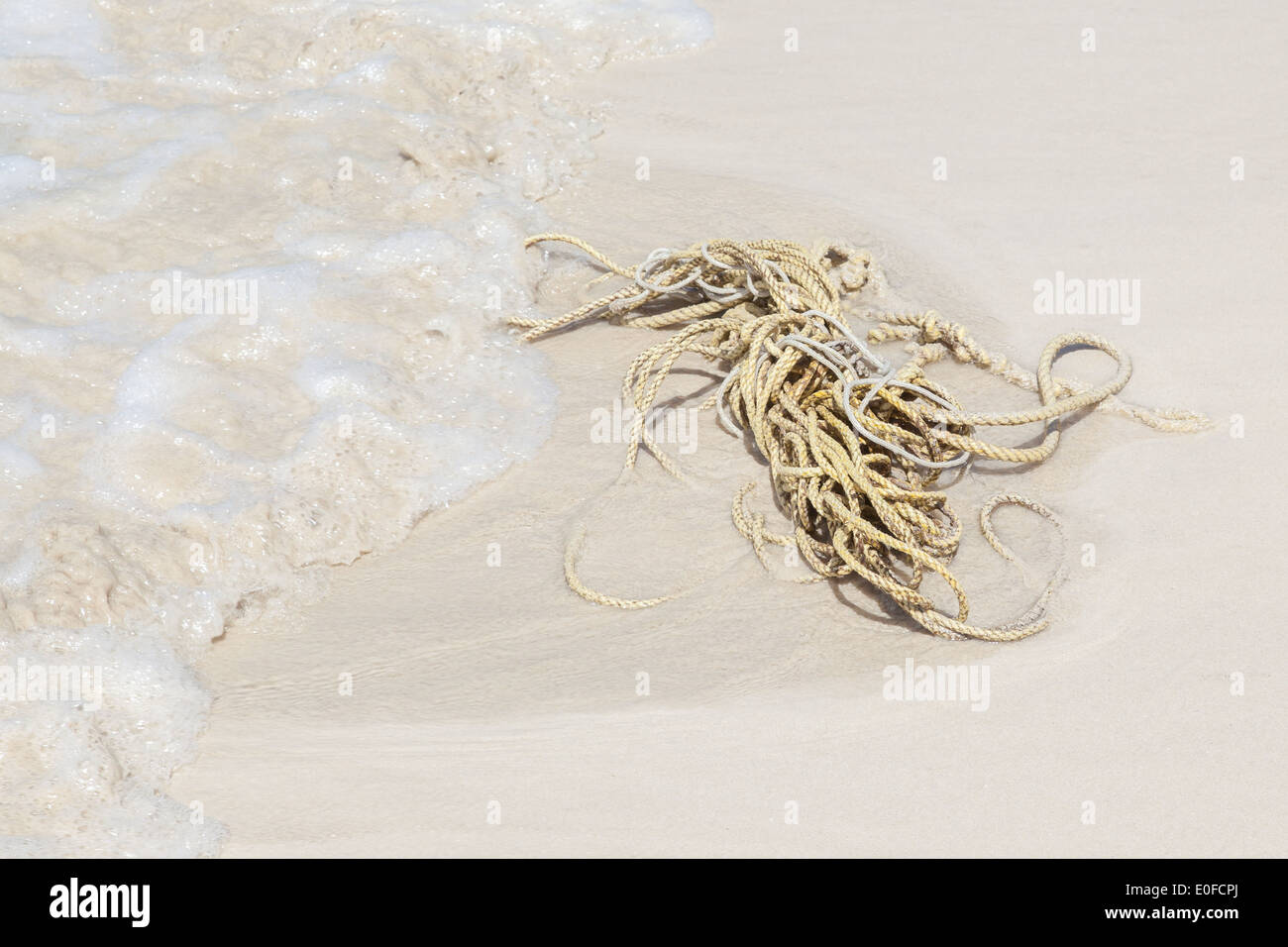 Long rope on the beach, debris on the Caribbean Stock Photo - Alamy