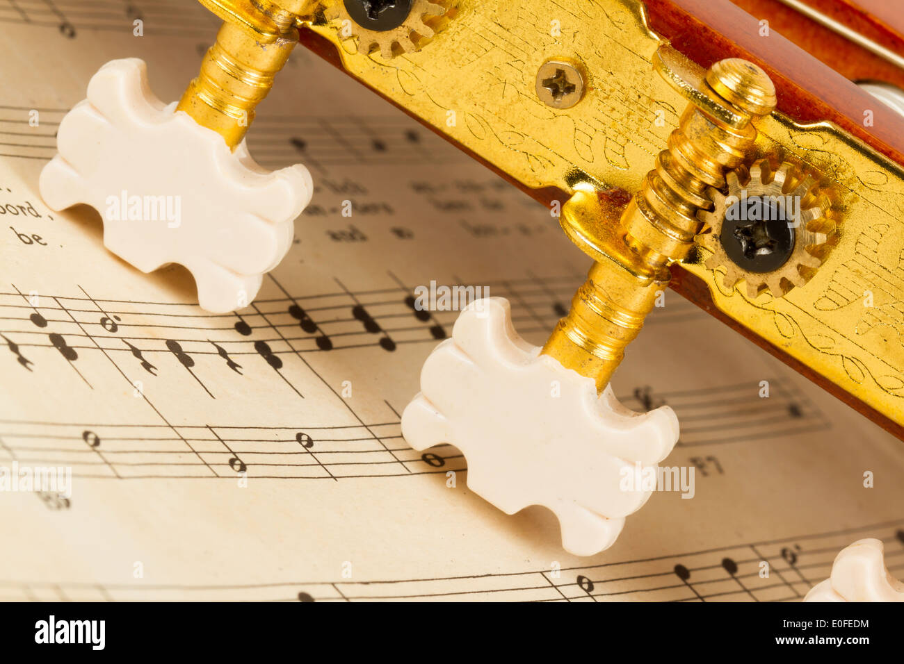 Old music sheet and a guitar isolated Stock Photo - Alamy