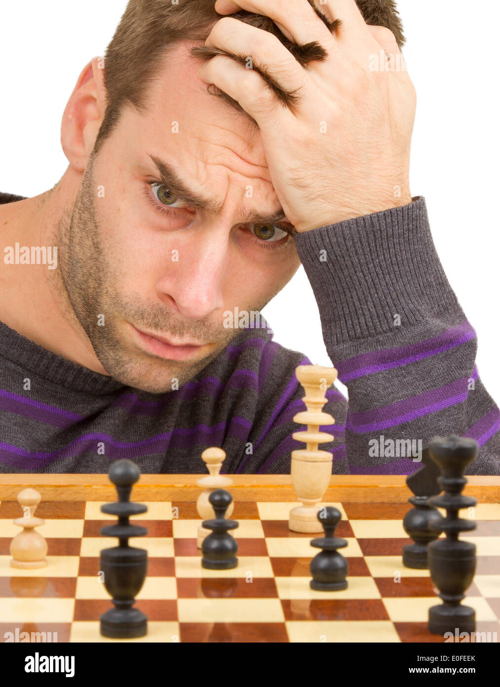 Chessboard with desperate man thinking about chess strategy, isolated ...