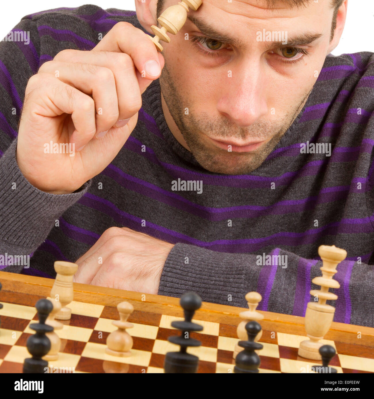 Chessboard with desperate man thinking about chess strategy, isolated ...