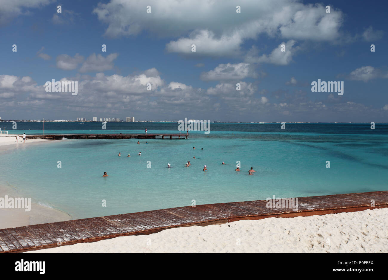 Tourists swimming in the clear blue Caribbean sea, Cancun, Mexico Stock ...