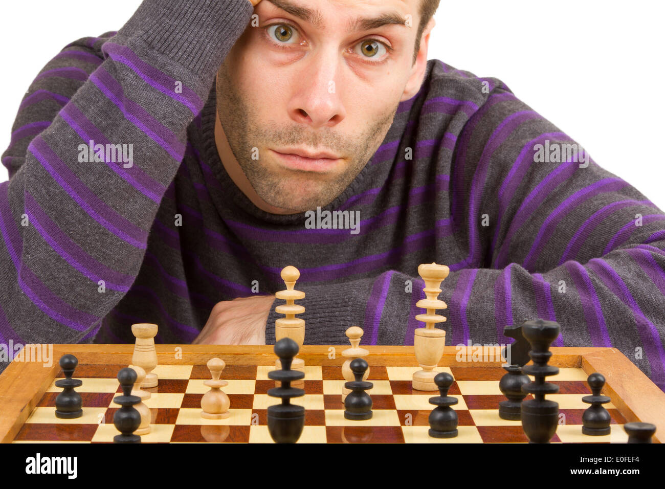 Chessboard with desperate man thinking about chess strategy, isolated ...