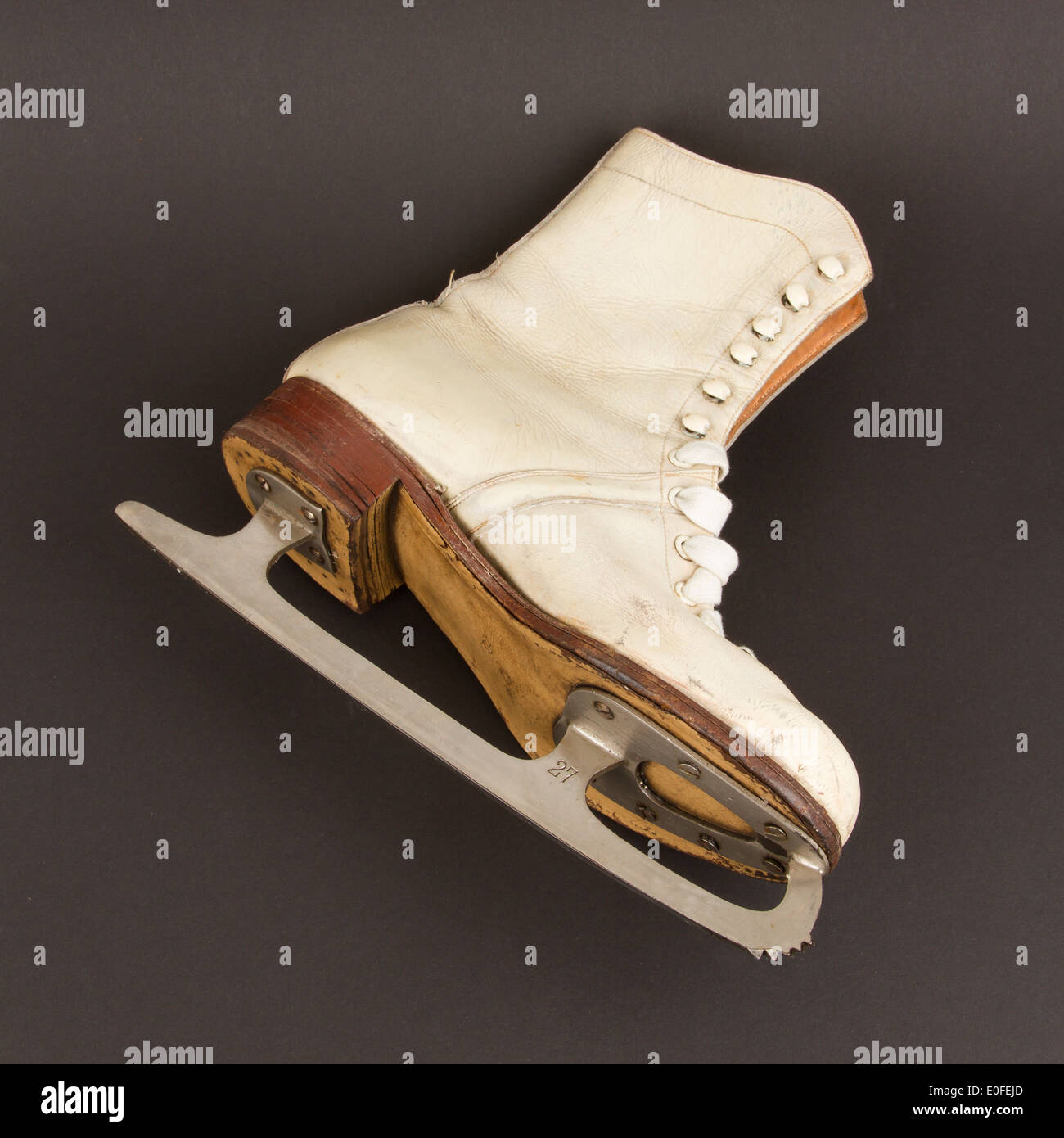 Very old figure skate, isolated on black background Stock Photo - Alamy