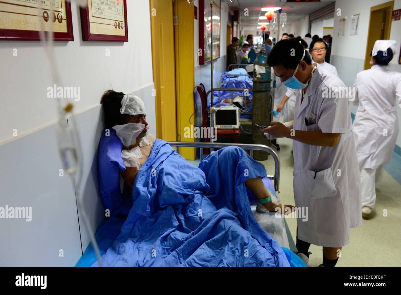 Yibin, China's Sichuan Province. 12th May, 2014. An injured person ...